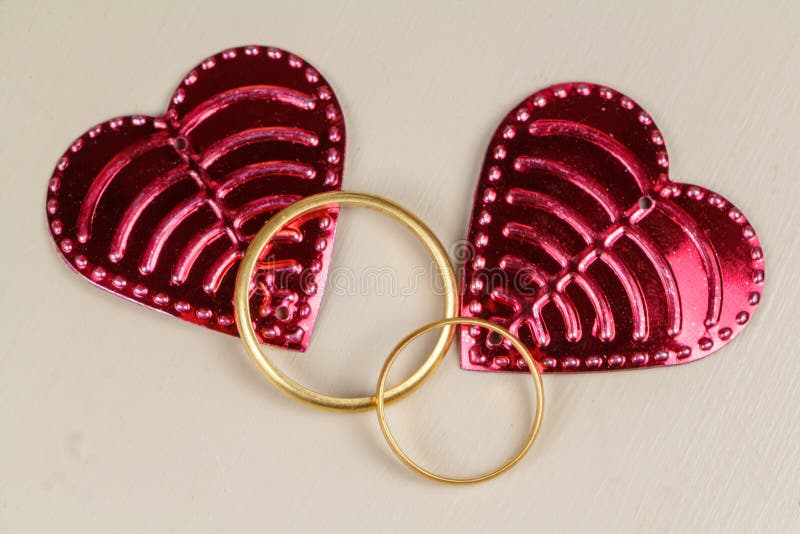 Two Wedding Rings in Gold and Hearts Stock Photo - Image of tradition ...