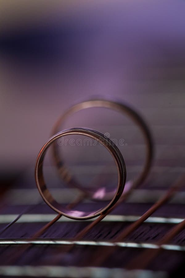 Two Wedding Rings on Guitar Strings. Shallow Depth of Field Stock Photo ...