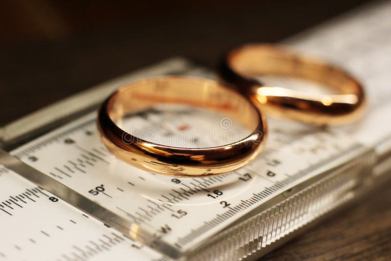Two Wedding Rings and Measuring Device Top View Stock Image - Image of ...