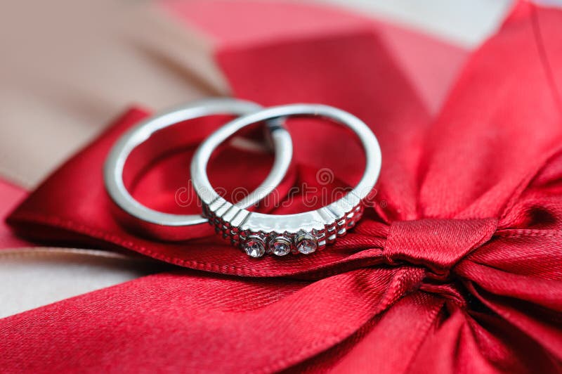 Two Wedding Rings on Red Background Stock Photo - Image of background ...