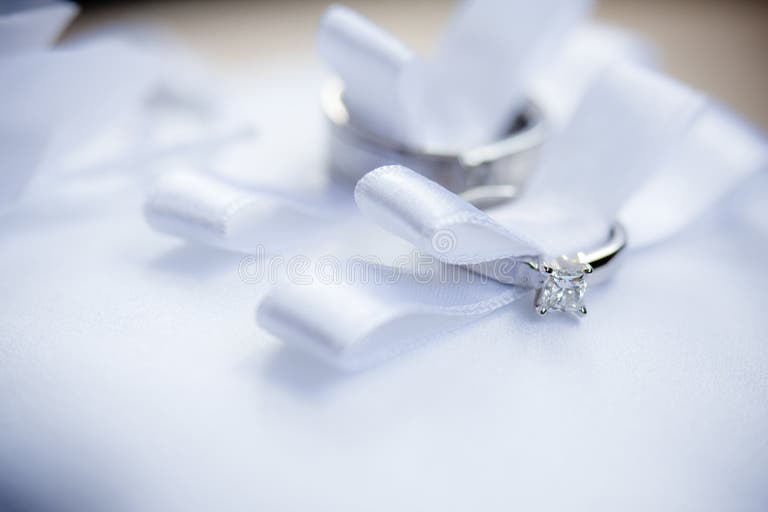 Two Wedding Rings in Ribbon Stock Photo - Image of ring, groom: 10715598
