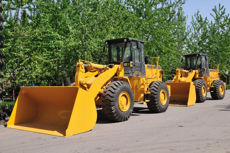 Two Wheel Loader Machine in Queue Stock Photo - Image of stop, place ...