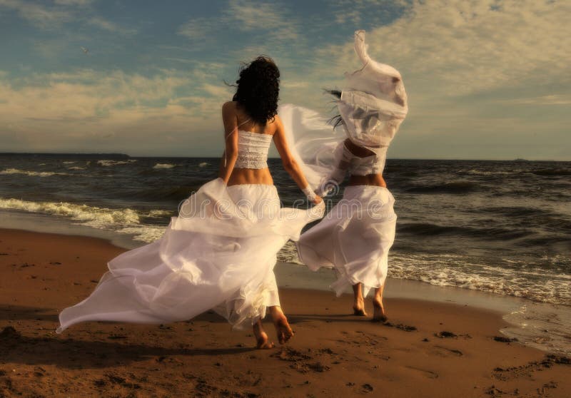 Two White Angels on the Beach Stock Image - Image of freedom, barefoot ...