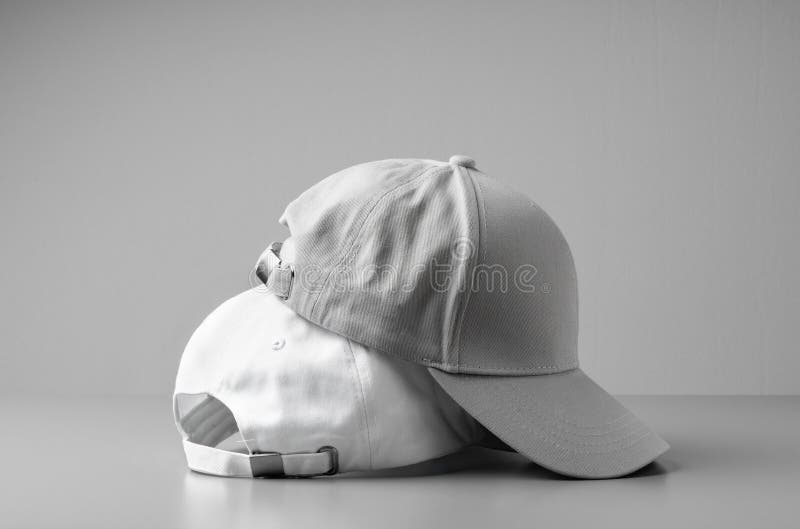 Two White Baseball Caps on a White Background Stock Photo - Image of ...