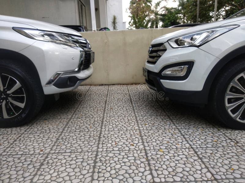 Two White Cars, Facing Each Other Stock Photo - Image of cara, white ...