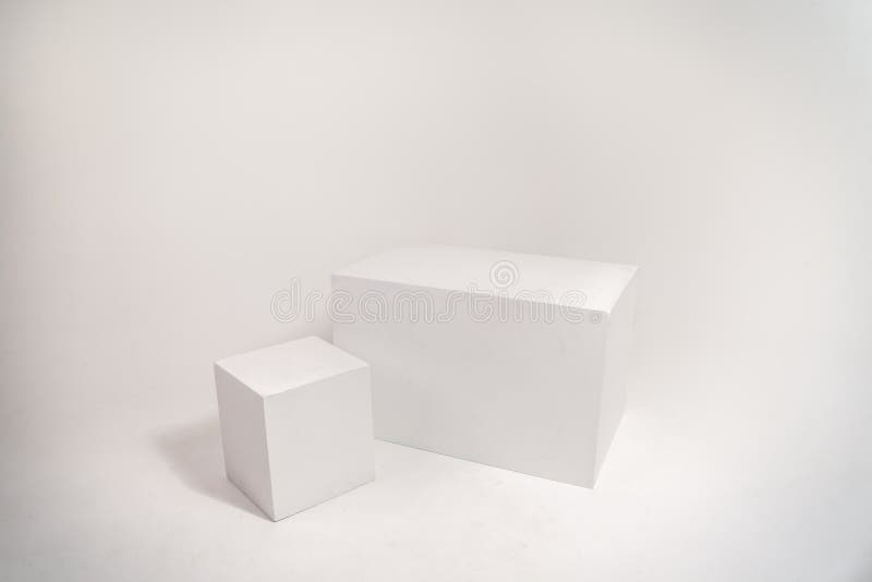 Two White Cubes on White Wall Stock Image - Image of studio, floor ...