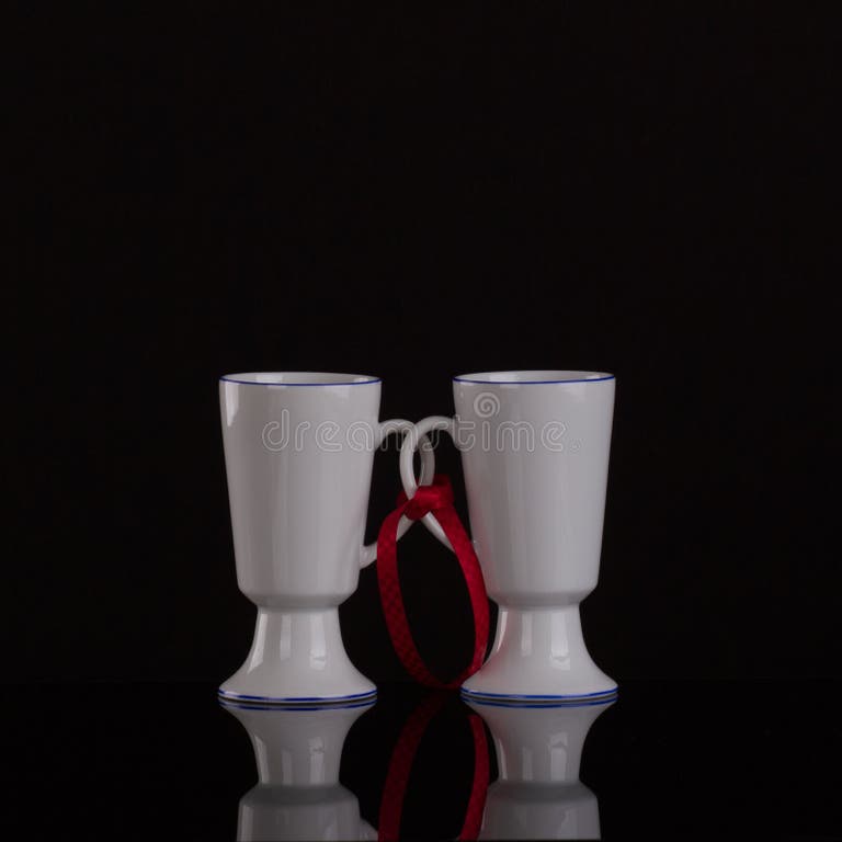 Two White Cups on the Associated with a Red Ribbon. Stock Photo - Image ...