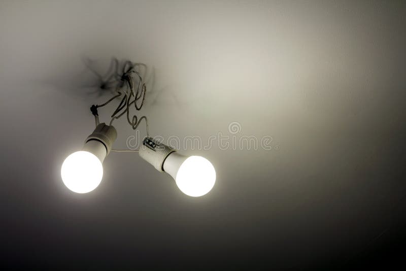 Two White Electric Bulbs on Ceiling Stock Photo - Image of illuminated ...