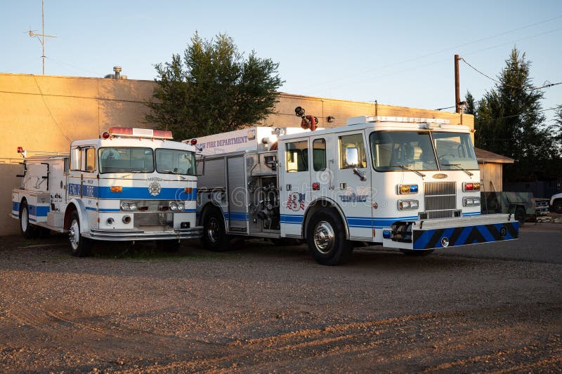 White Fire Trucks are Parked Next To Each Other in a Parking Lot ...
