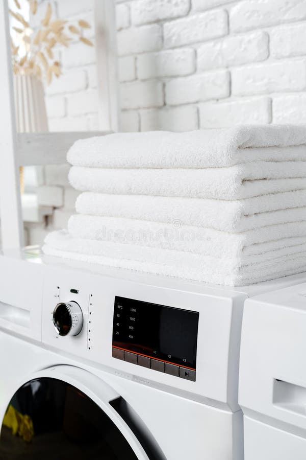 Two White Front Loading Washing Machines in Modern Laundry Room Stock ...