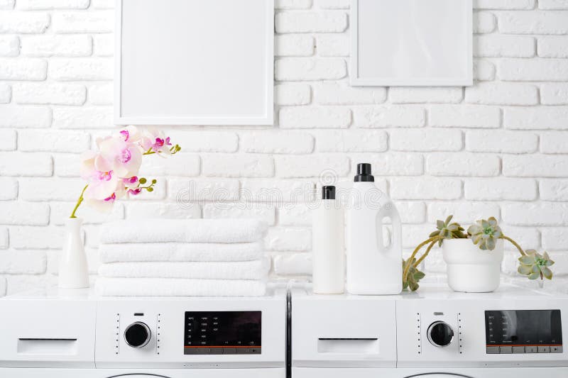 Two White Front Loading Washing Machines in Modern Laundry Room Stock ...