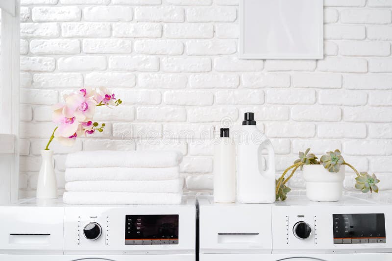 Two White Front Loading Washing Machines in Modern Laundry Room Stock ...