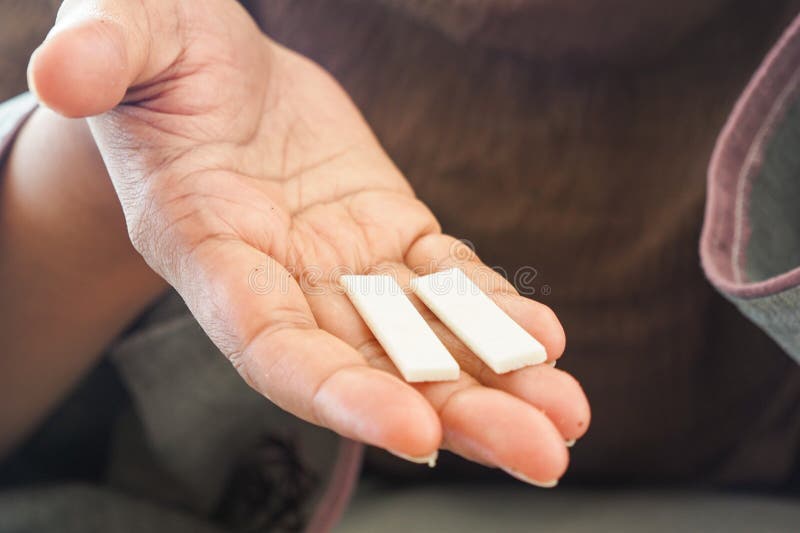 Two White Gum Held in a Hand Stock Image - Image of leisure, handheld ...