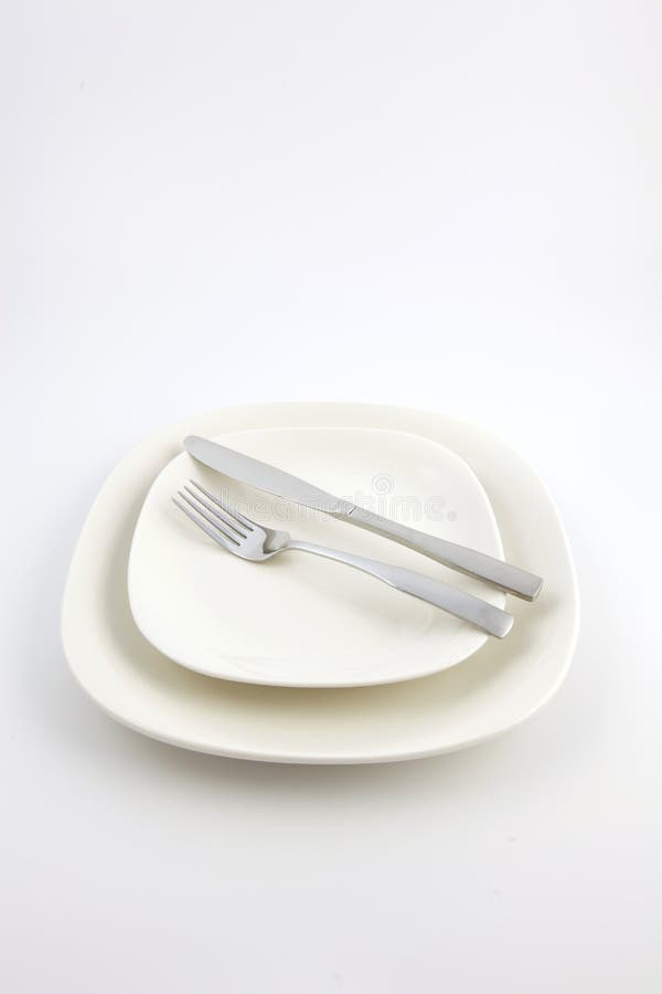 Two White Plates and a Knife and Fork Stock Photo - Image of dining ...
