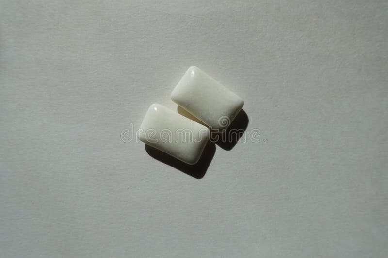 Two White Pieces of Chewing Gum from Above Stock Photo - Image of pair ...