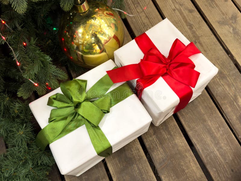 Two White and Red Boxes with Green Ribbons on Them Stock Photo - Image ...