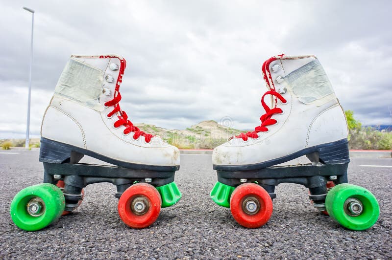 Two White Roller Skates with Red Laces and Green Wheels Stock Image ...