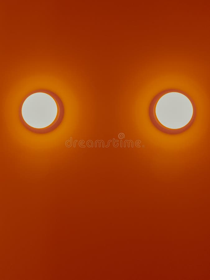 Two White Round Light Bulbs on Orange Wall. Stock Image - Image of ...