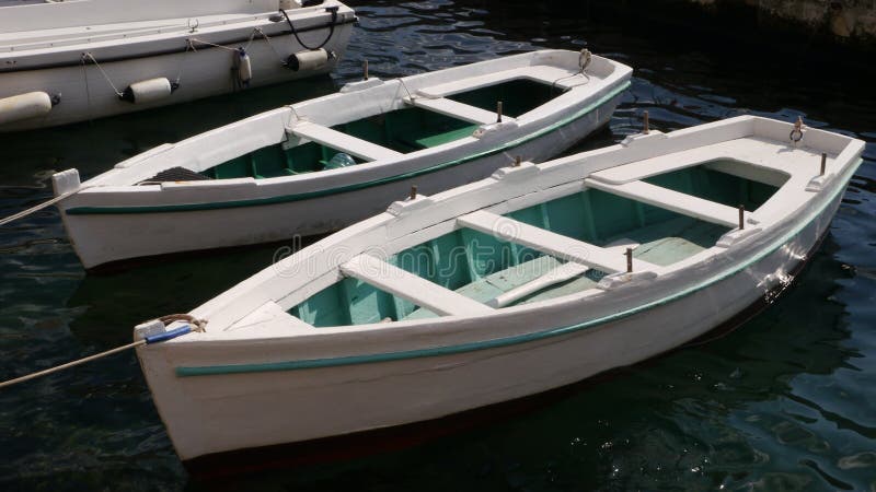 Two White Rowing Boats Moored in a Harbour Stock Photo - Image of ...