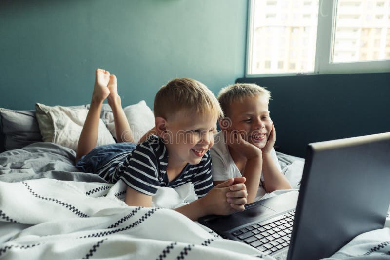 Two White Schoolboy Boys Enjoy and Study with a Laptop Stock Image ...