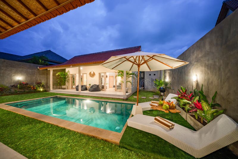 Two White Sun Loungers by the Pool in the Luxury Villa Stock Photo ...