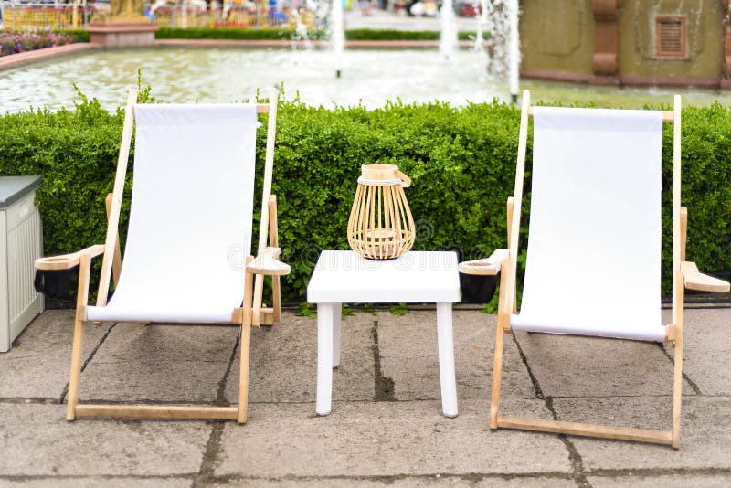 Two White Sun Loungers with Table in the Open Air Stock Image - Image ...