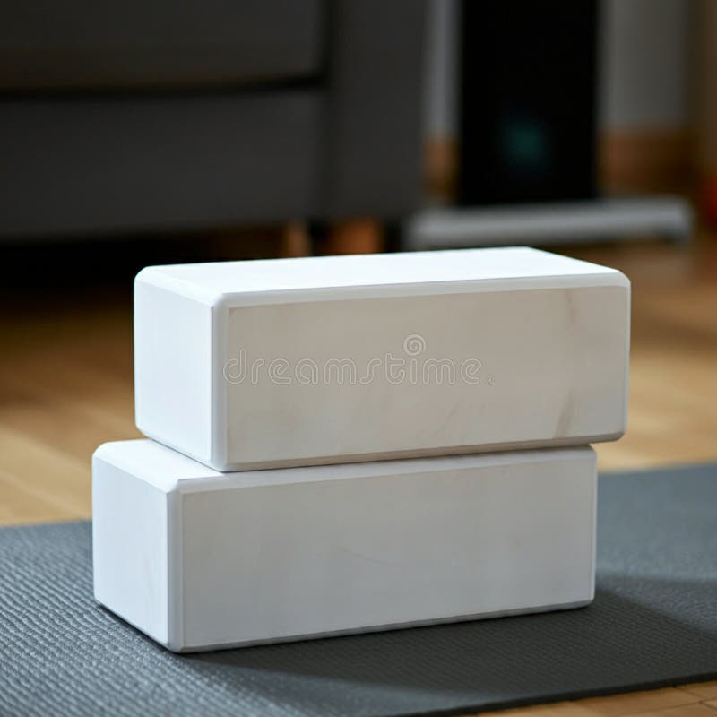 Two White Yoga Blocks Stacked on a Gray Exercise Mat. the Blocks are ...