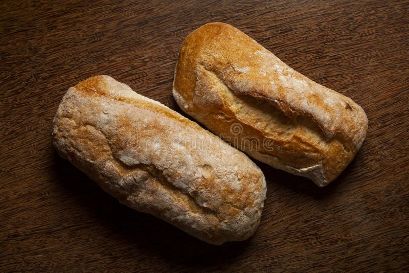 Two Whole Grain Breads on Wooden Table. Stock Image - Image of ...