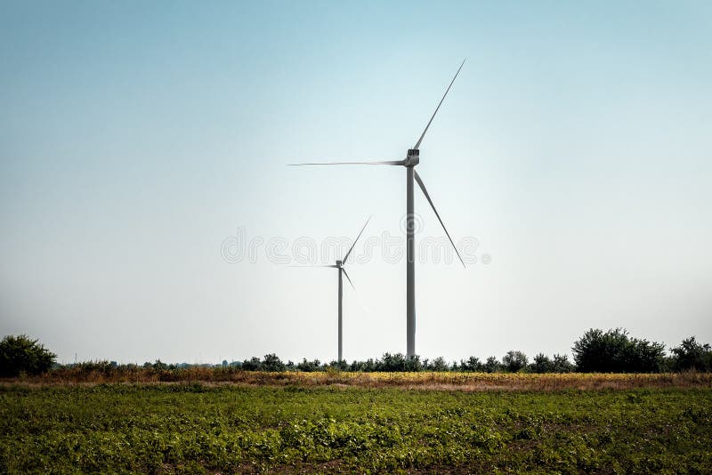Two Windmill Turbines in the Field Stock Photo - Image of global, cloud ...