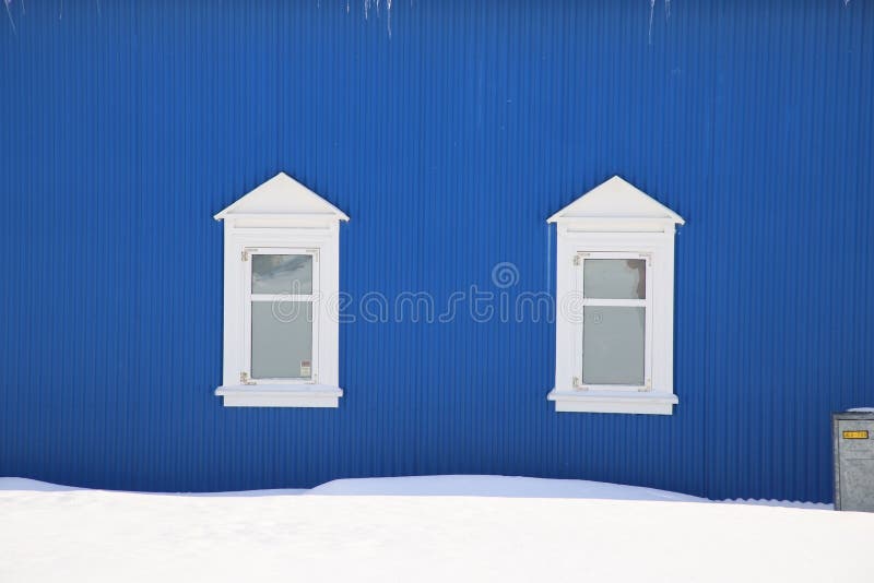 Two windows and blue. stock photo. Image of colour, blue - 141407388