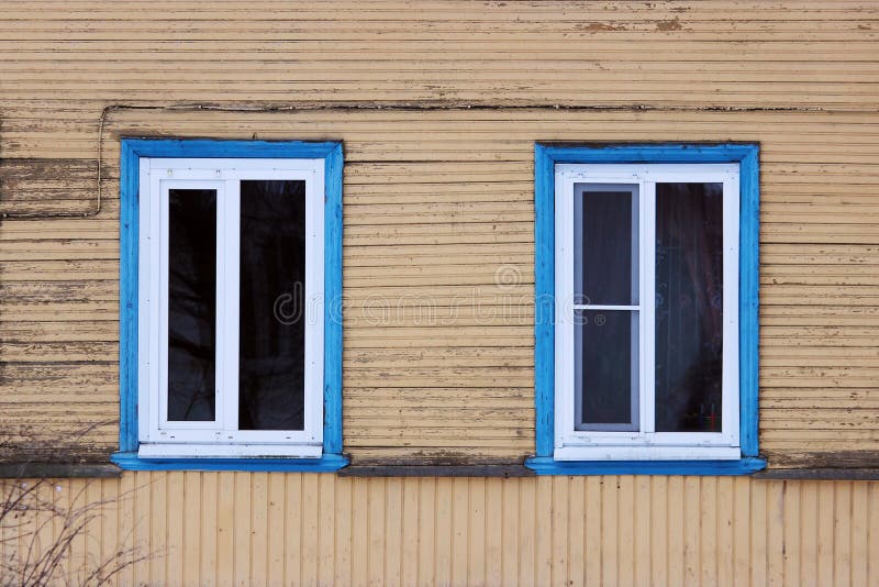 Two Windows in the Blue Framed in a Wooden House, Painted Beige Paint ...