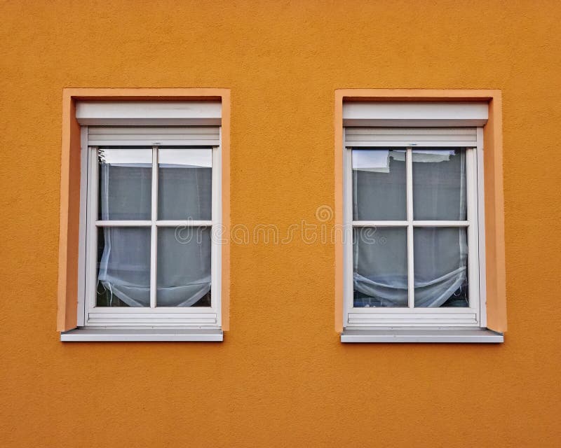 Two Windows and Colorful Orange Wall Stock Image - Image of wall ...