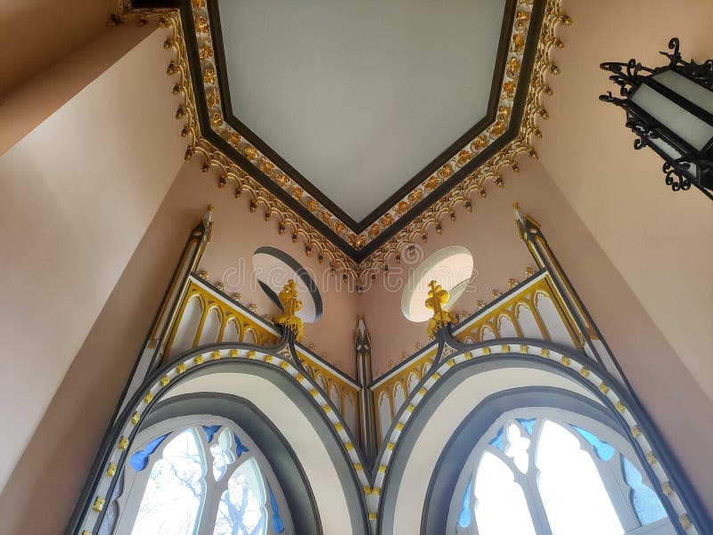 Two Windows with Multi-colored Glass and Patterns on the Ceiling and ...