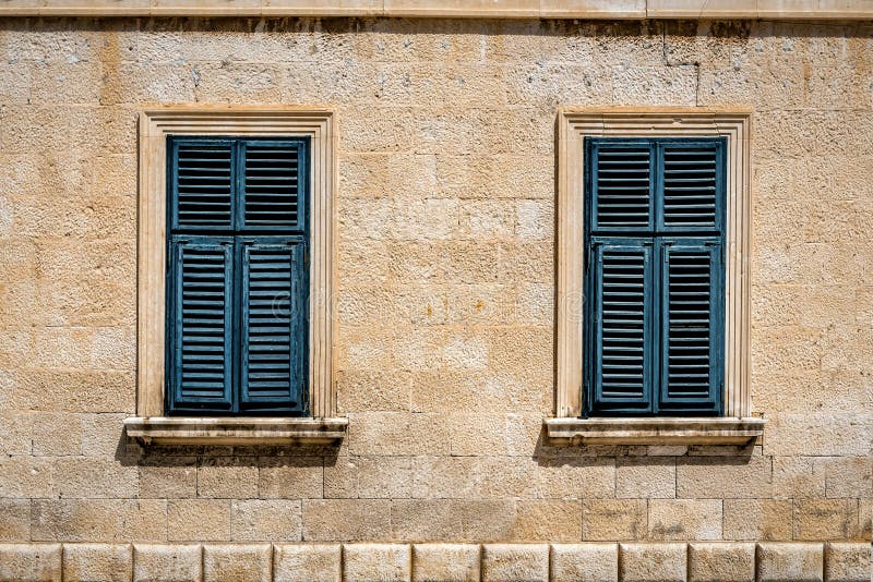 Two Windows in Old Wall with Closed Shutters Stock Image - Image of ...