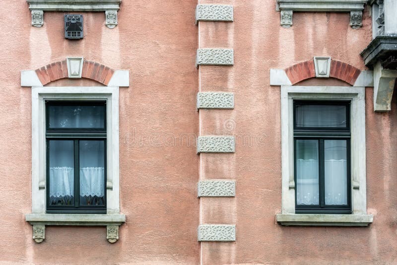 Two windows on pink stock image. Image of cornice, cityscape - 258991017