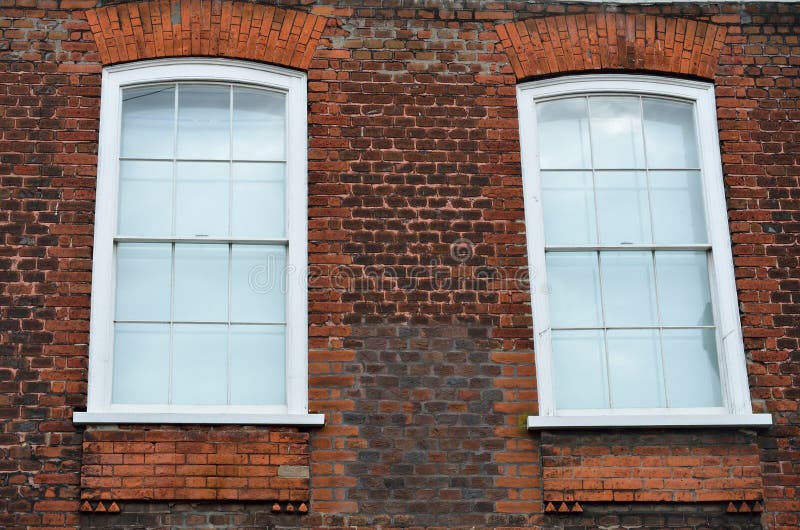 Two windows in red brick stock photo. Image of glass - 38682550