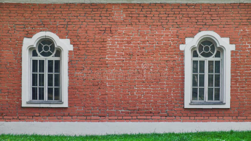 Two Windows in a Row on Brick Wall of Old House. Stock Image - Image of ...