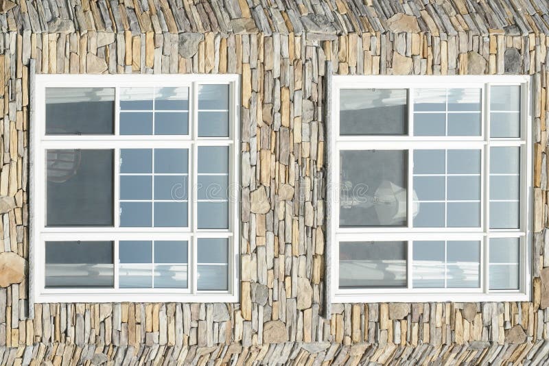 Two Windows in a Stone Wall Stock Image - Image of siding, white: 4726399
