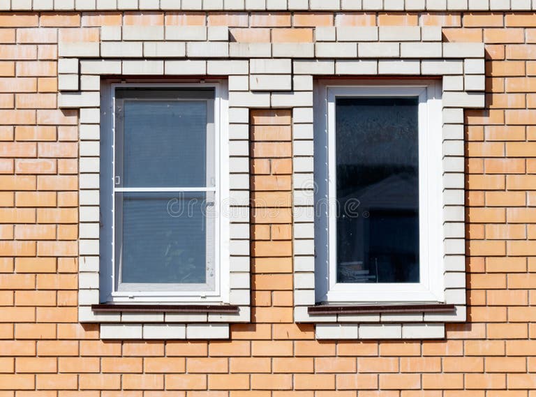 Two Windows with White Frames Sit on a Brick Wall Stock Image - Image ...