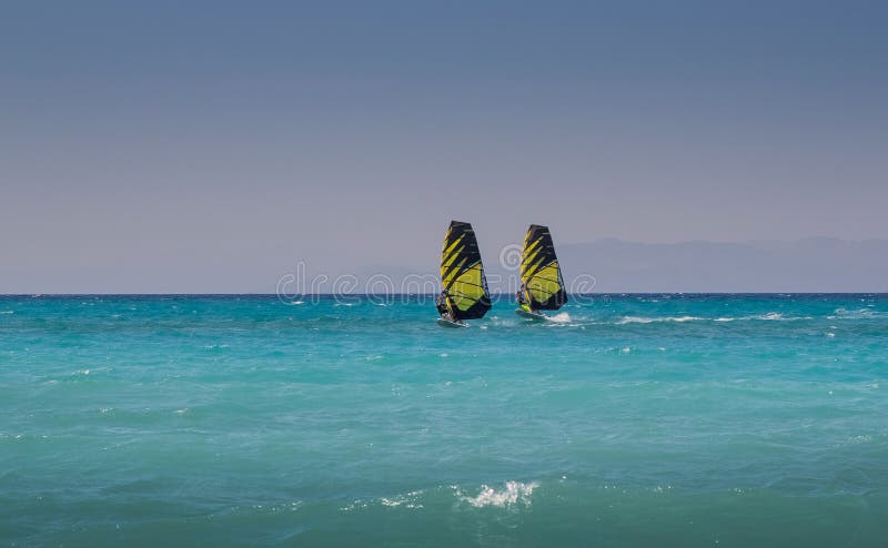 Two Windsurfers Ride Parallel in Sea Stock Photo - Image of surfer ...