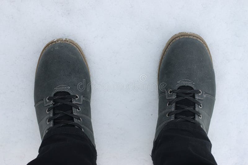 Two Winter Boots with Lacing on the Snow Top View Stock Photo - Image ...