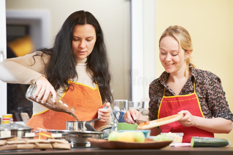 Two Woman Cooking in Kitchen Stock Photo - Image of apron, caucasian ...
