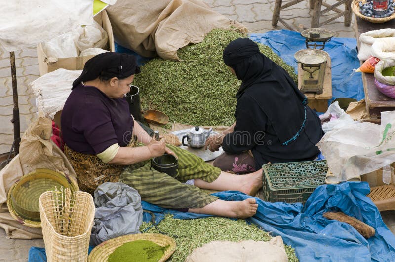 Two woman making tea editorial stock photo. Image of dealer - 17657883
