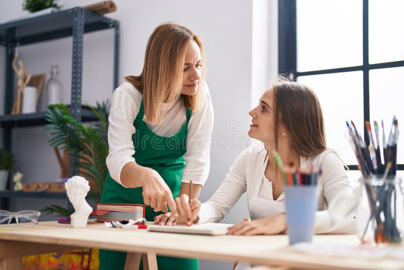 Two Women Artists Drawing on Notebook at Art Studio Stock Image - Image ...