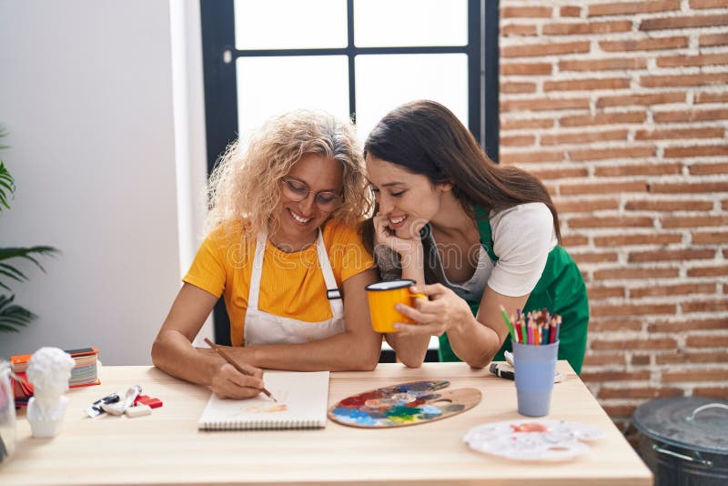 Two Women Artists Smiling Confident Drawing on Notebook at Art Studio ...