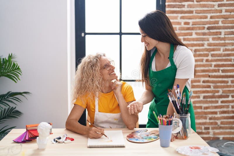 Two Women Artists Smiling Confident Drawing on Notebook at Art Studio ...