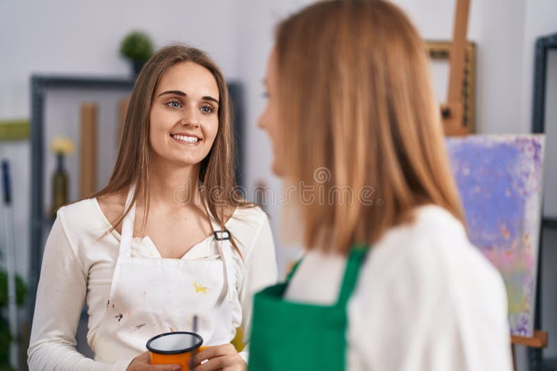 Two Women Artists Smiling Confident Drinking Coffee Drawing at Art ...