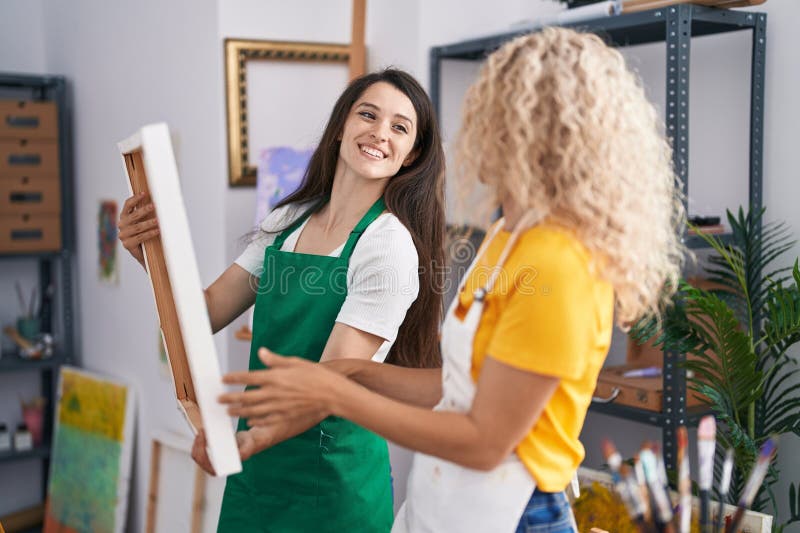 Two Women Artists Smiling Confident Holding Draw at Art Studio Stock ...