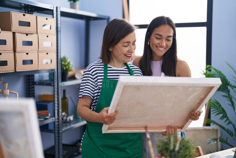 Two Women Artists Standing Together Looking Draw at Art Studio Stock ...