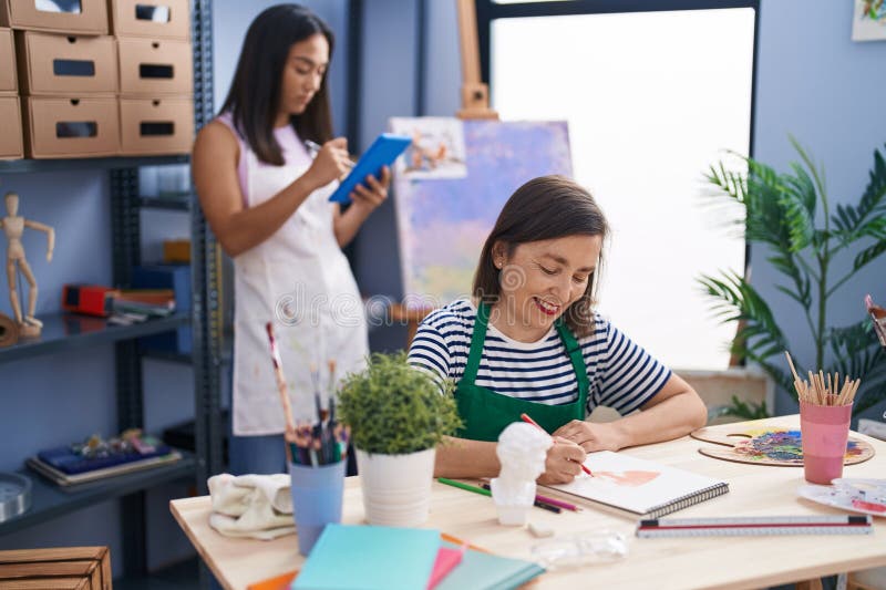 Two Women Artists Using Touchpad Drawing on Notebook at Art Studio ...
